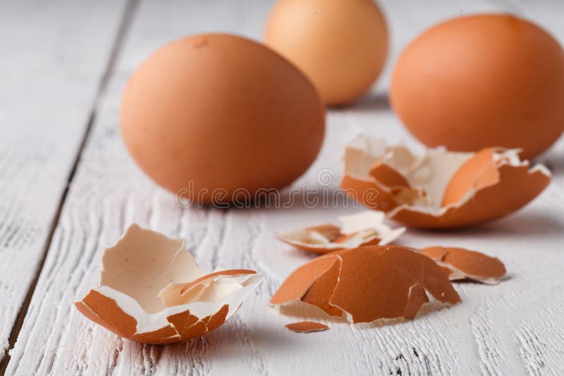 Fresh Hard Boiled Eggs with Shell beside on Wooden Board Stock Image ...