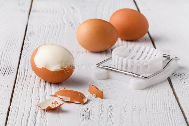 Fresh Hard Boiled Eggs with Shell beside on Wooden Board Stock Photo ...