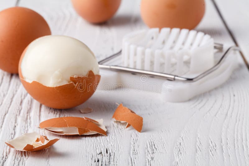 Fresh Hard Boiled Eggs with Shell beside on Wooden Board Stock Image ...