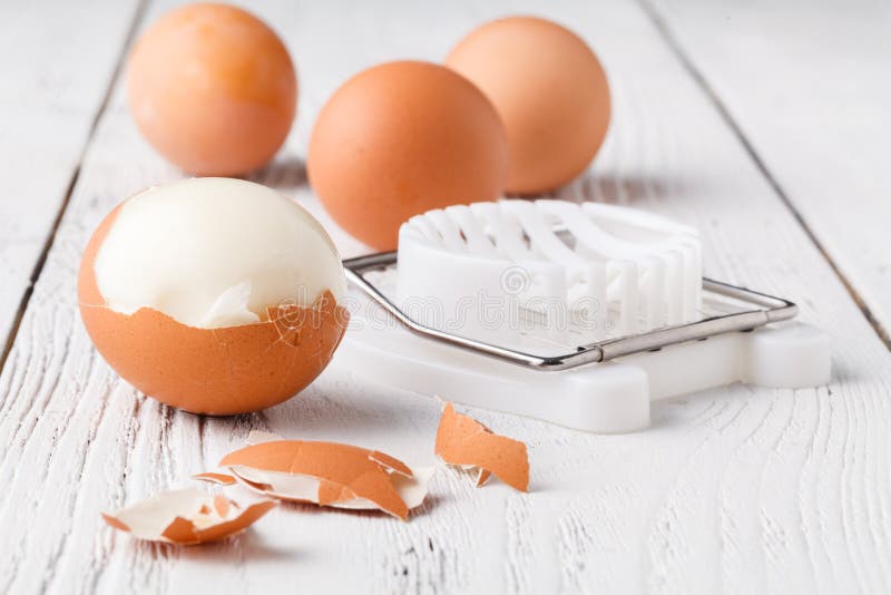 Fresh Hard Boiled Eggs with Shell beside on Wooden Board Stock Image ...