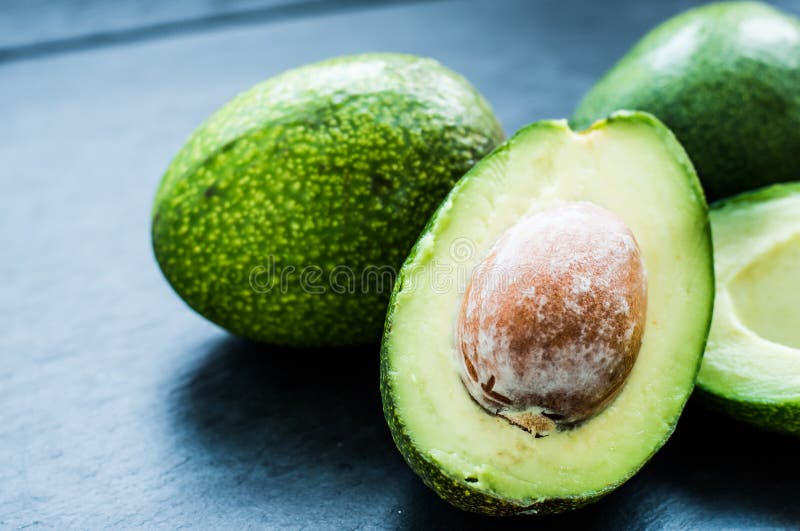 Fresh Healthy Avocado on a Table Stock Photo - Image of organic ...