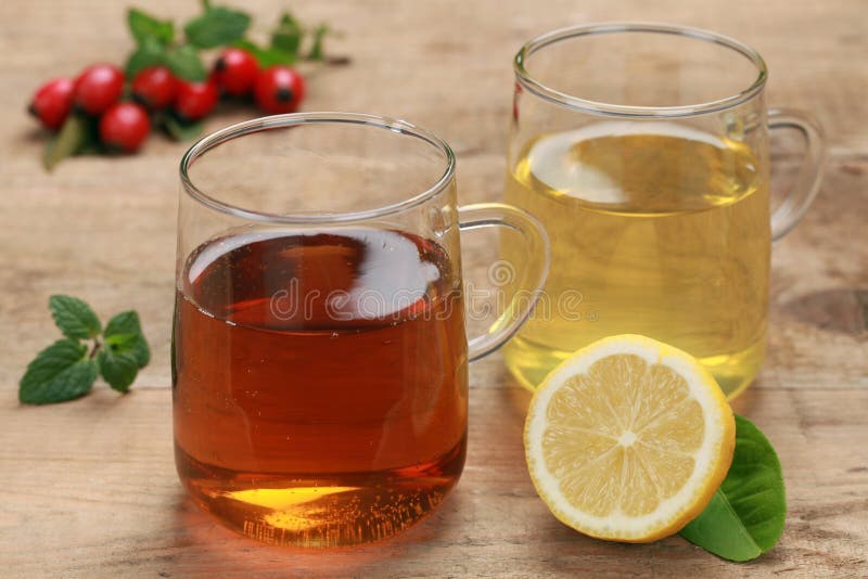 Cup of Fresh Herbal Tea with Healing Herbs and Flowers on Aged Rustic ...