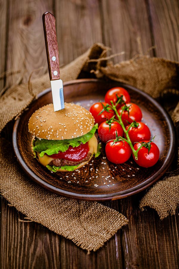 Fresh Homemade Beef Burger on Rustic Wooden Serving Table with Knife ...