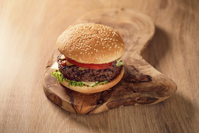 Fresh Homemade Burger with Marble Beef, Cheese and Vegetables on Olive ...