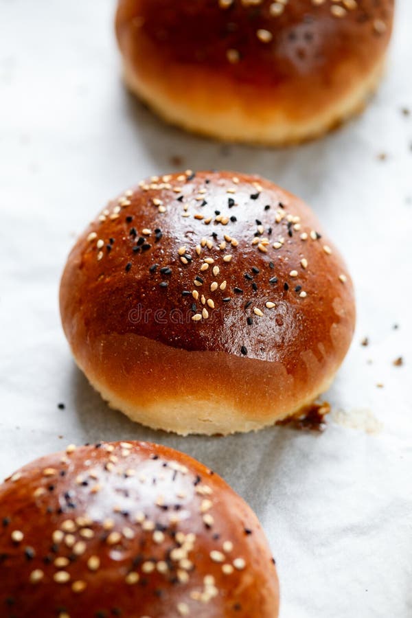 Fresh Homemade Hamburger Buns, Baps on Baking Paper Stock Photo - Image ...