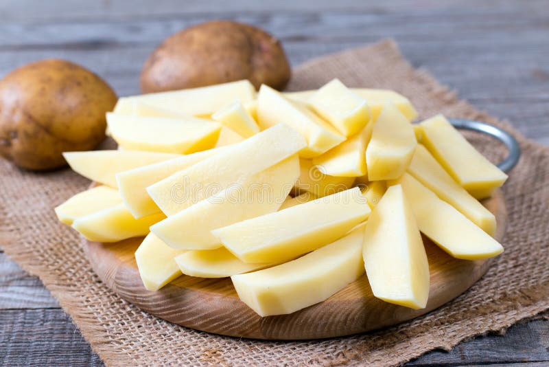Fresh Homemade Potato Pieces on the Cutting Board Stock Image - Image ...