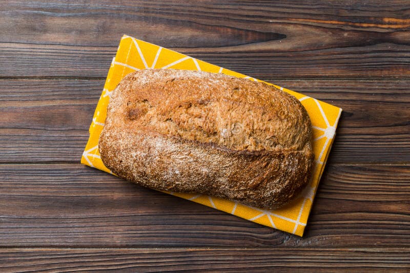 Fresh Homemade Whole Wheat Bread. Bread on Napkin on Rustic Background ...