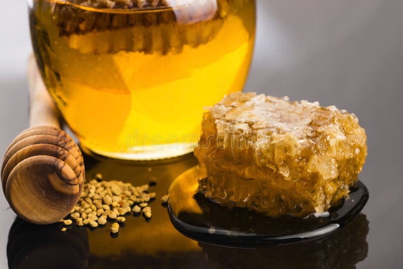 Fresh honey with honeycomb stock photo. Image of beeswax - 53758286
