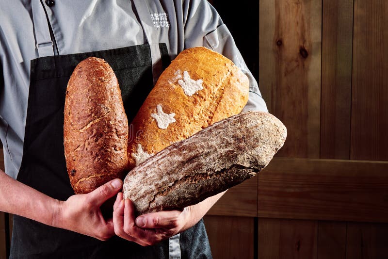 Fresh Hot Bread. Baker Holds Breads Stock Photo - Image of freshness ...