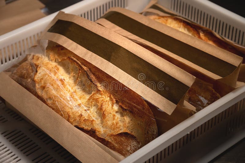 Fresh Hot Bread Packed in Paper Bags in a Plastic Box Stock Image ...