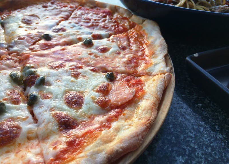 Fresh Italian Pizza Served on the Table Stock Photo - Image of ...