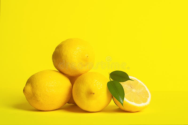 Fresh Juicy Lemon Slides on a Bright Yellow Background. Concept ...