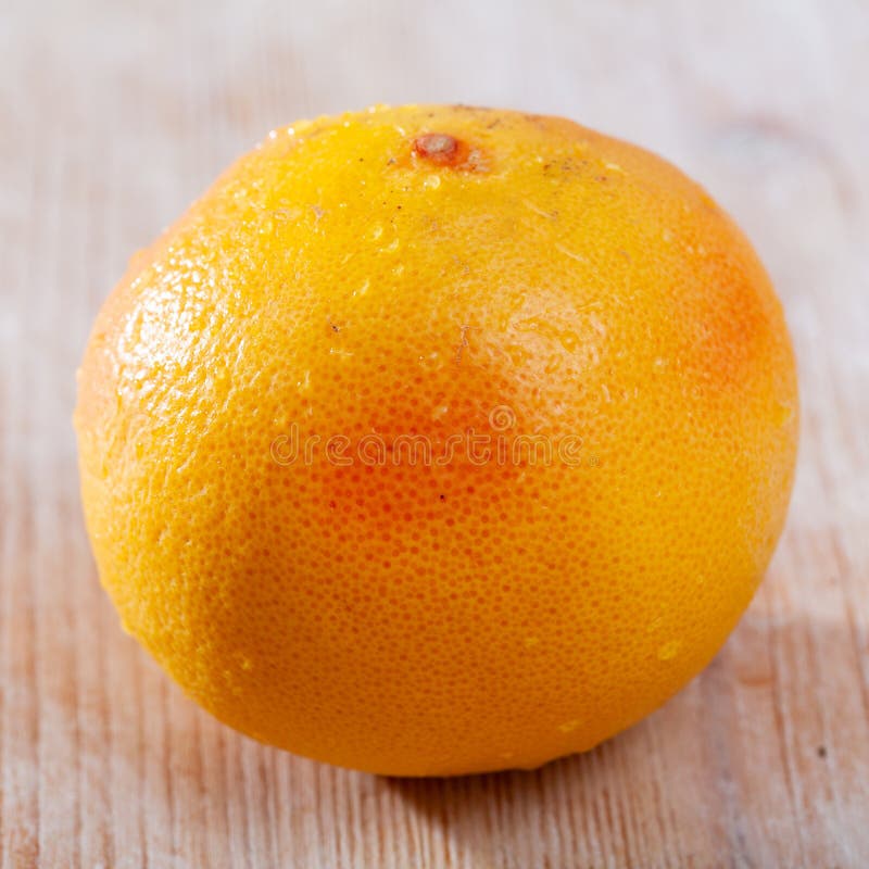 Whole Grapefruit on Wooden Table Stock Photo - Image of dining, sweet ...