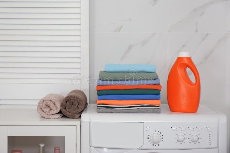 Fresh Laundry and Detergent on Washing Machine in Room Stock Image ...
