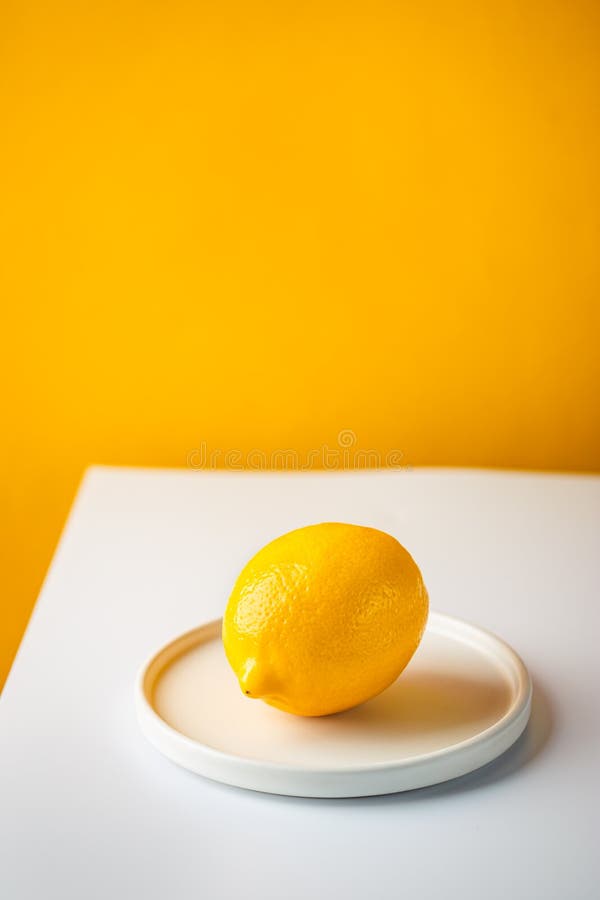 Fresh lemon on blue plate stock image. Image of ripe - 116086297