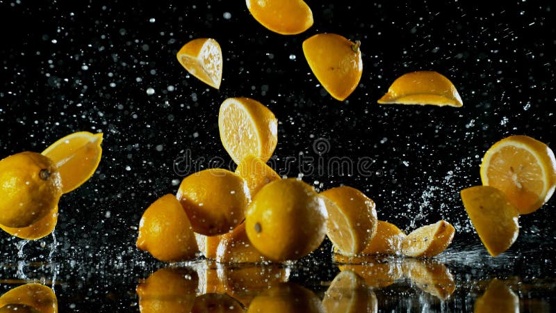 Fresh Lemon Slices Falling Down on Black Background Stock Image - Image ...