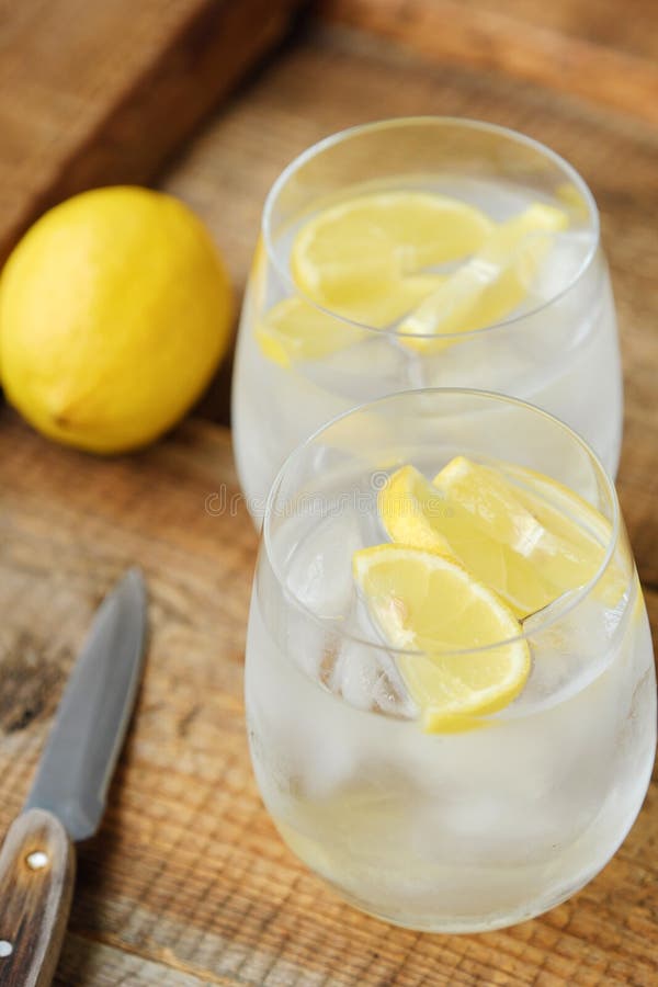 Fresh Lemonade with Ice and Lemon on the Table Stock Image - Image of ...