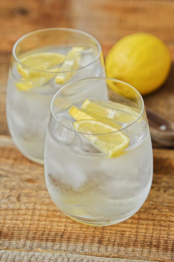 Fresh Lemonade with Ice and Lemon on the Table Stock Image - Image of ...