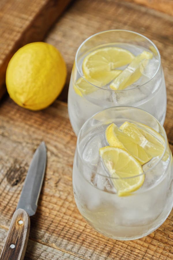 Fresh Lemonade with Ice and Lemon on the Table Stock Image - Image of ...