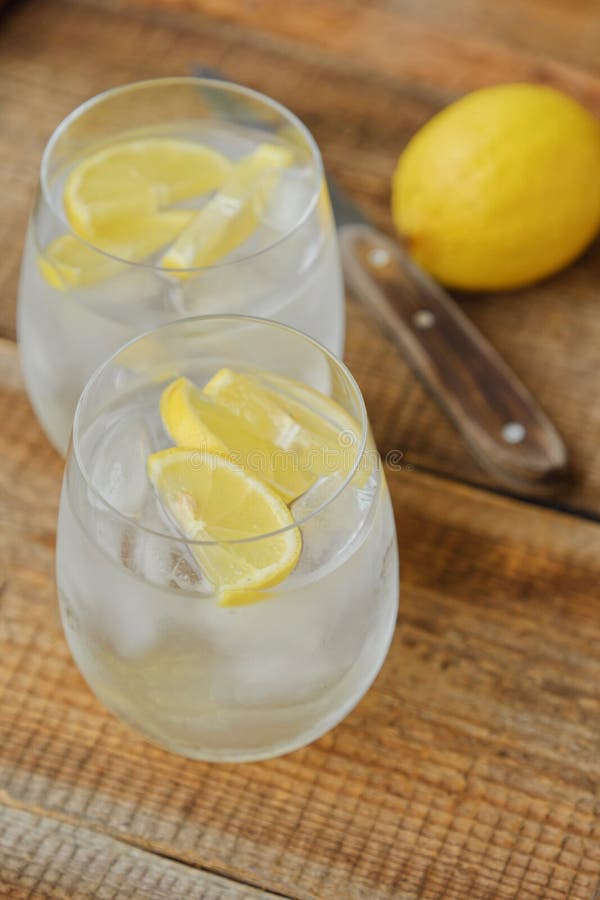 Fresh Lemonade with Ice and Lemon on the Table Stock Photo - Image of ...