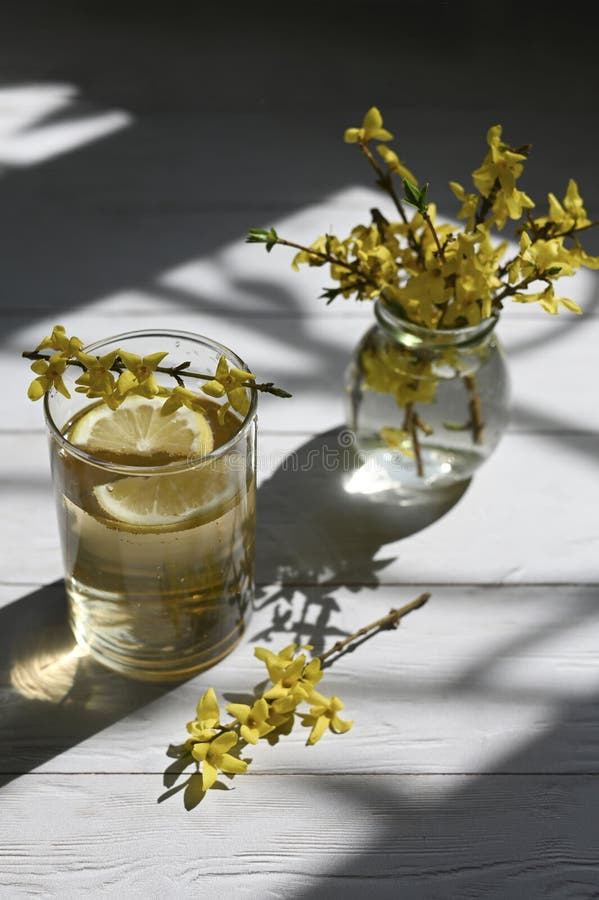 Fresh Lemonade with Yellow Flowers on the Table Stock Photo - Image of ...