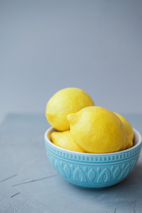 Lemons in blue bowl stock photo. Image of fruit, bowl - 15102362
