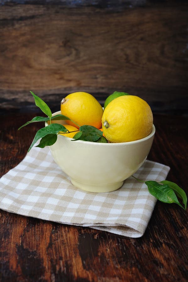 Fresh Lemons in the Bowl on the Table Stock Image - Image of flavored ...