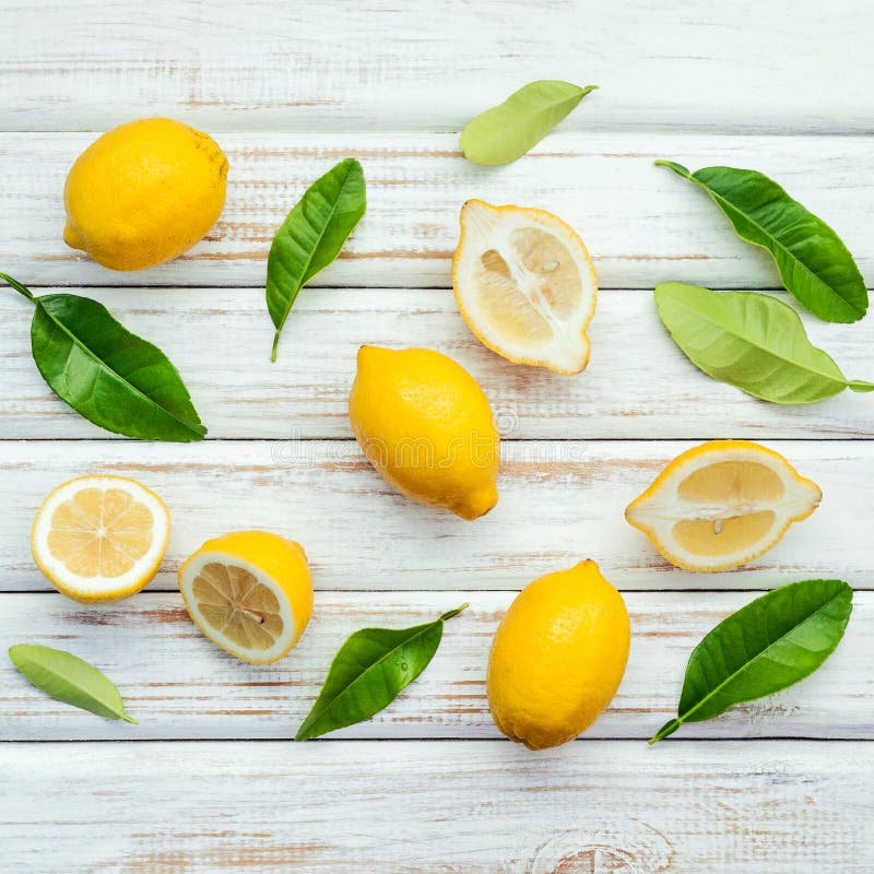 Fresh Lemons and Lemons Leaves on Rustic Wooden Background. Fre Stock ...