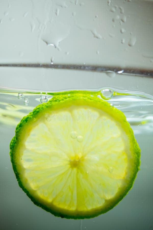 Lime in a glass of water. stock photo. Image of garnished - 207166982