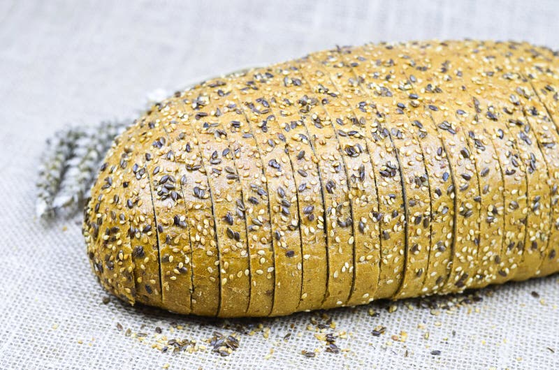 Fresh loaf of bread sliced stock image. Image of linseed - 59269347