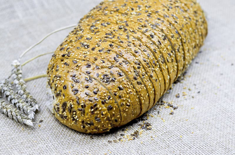 Fresh loaf of bread sliced stock image. Image of linseed - 59269381