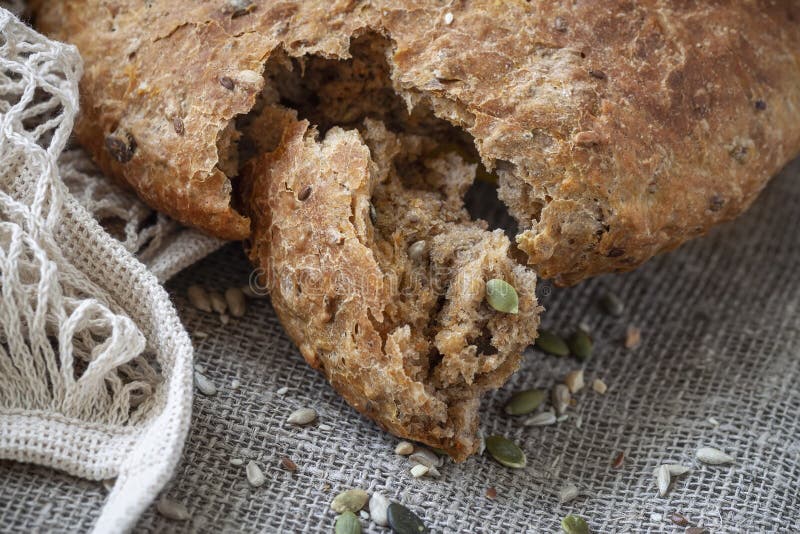 Fresh Loaf of Multi-grain Bread and Torn Off Delicious Stock Photo ...