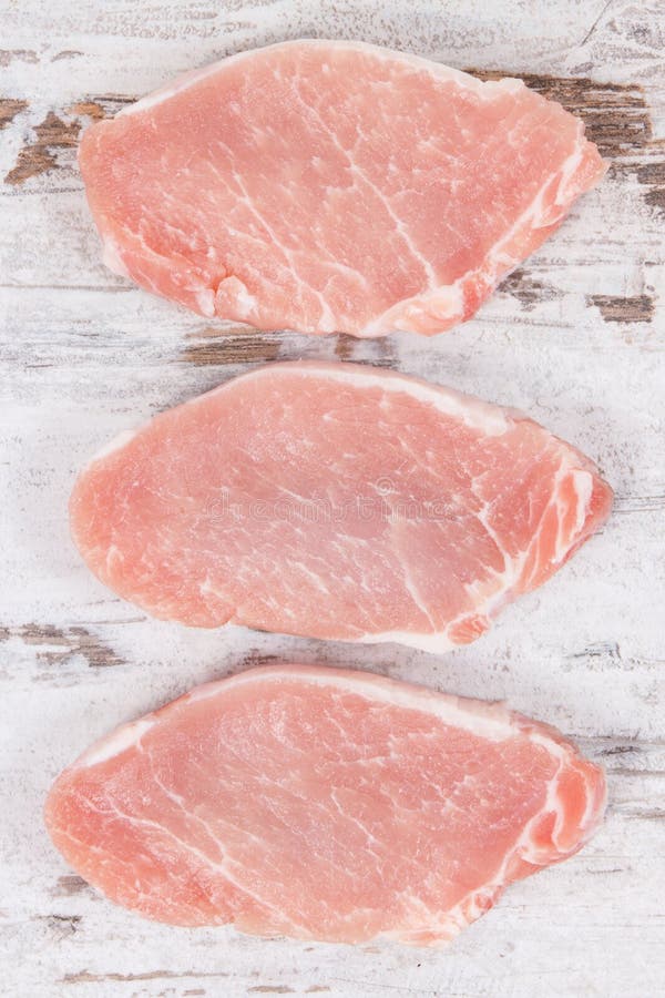 Fresh Loin for Cooking Lunch or Dinner on Old Rustic Board Stock Photo ...