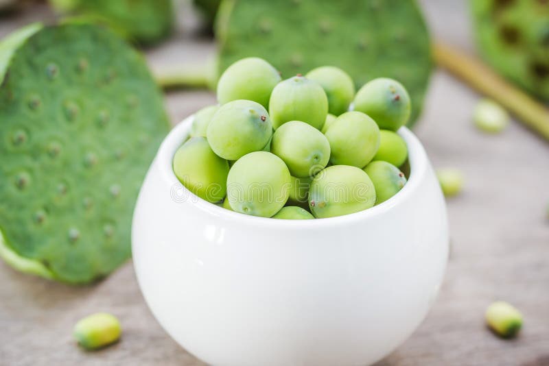 Fresh Lotus Seeds in Vase and on Wooden Table. Stock Photo - Image of ...