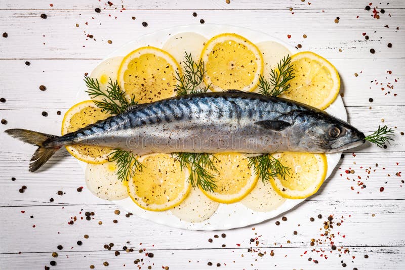 Fresh Mackerel on a Plate on a White Table Stock Photo - Image of ...