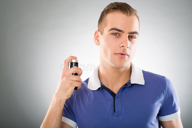 Handsome Young Man Using Perfume Stock Photo - Image of bottle, morning ...