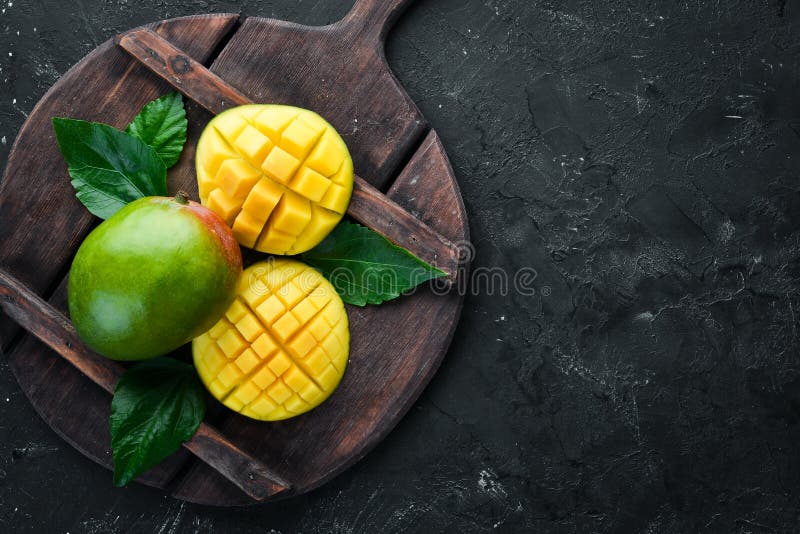 Fresh Mango on a Black Background. Top View Stock Photo - Image of ...