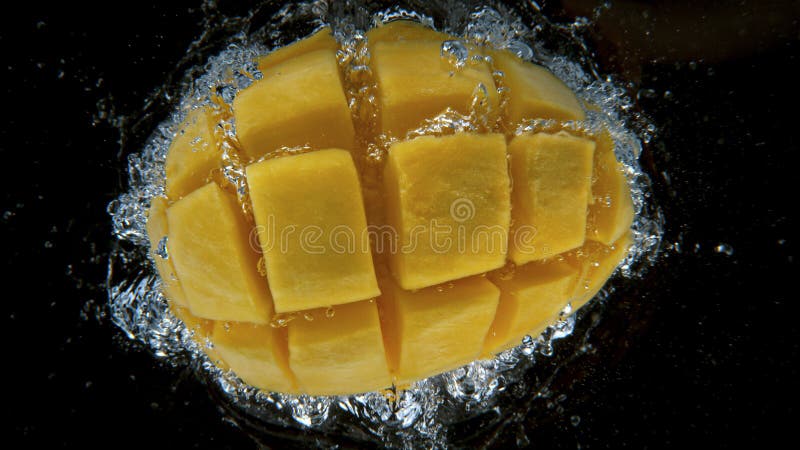 Fresh Mango Falling into Water, Freeze Motion. Stock Image - Image of ...