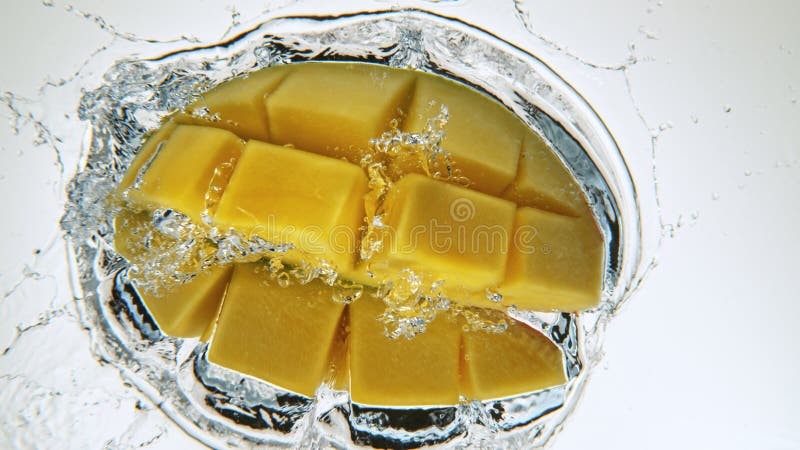 Fresh Mango Falling into Water, Freeze Motion. Stock Photo - Image of ...