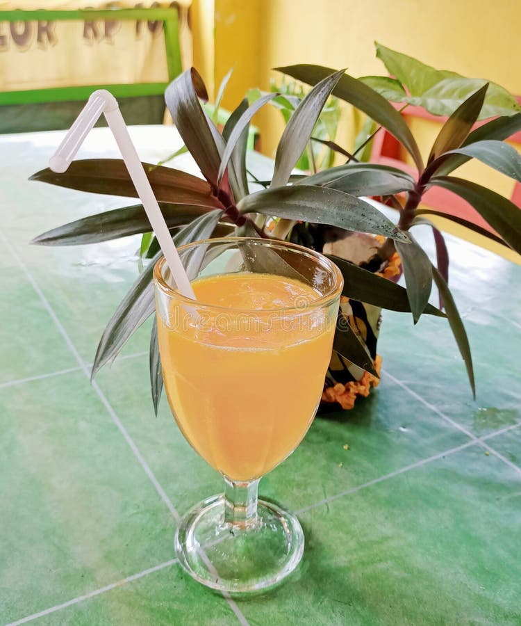 FRESH MANGO JUS stock photo. Image of bottle, glass - 209249248