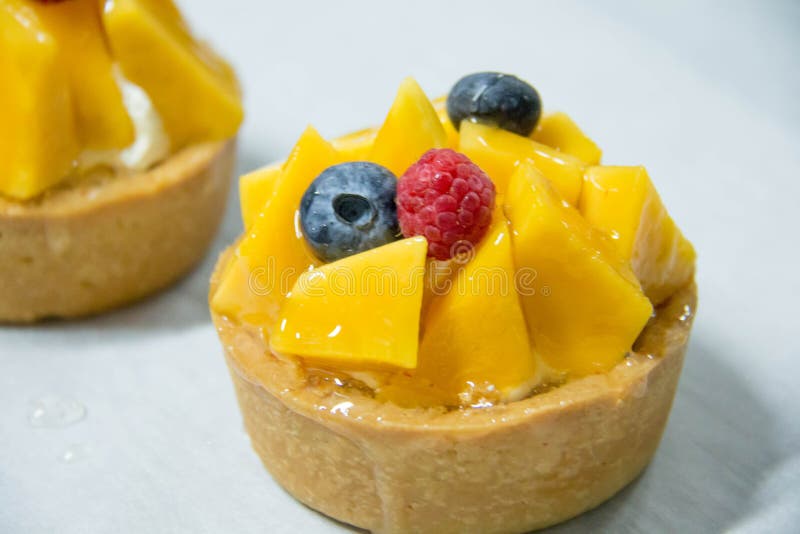 Fresh Mango Tart on White Paper Stock Photo - Image of delicious, white ...