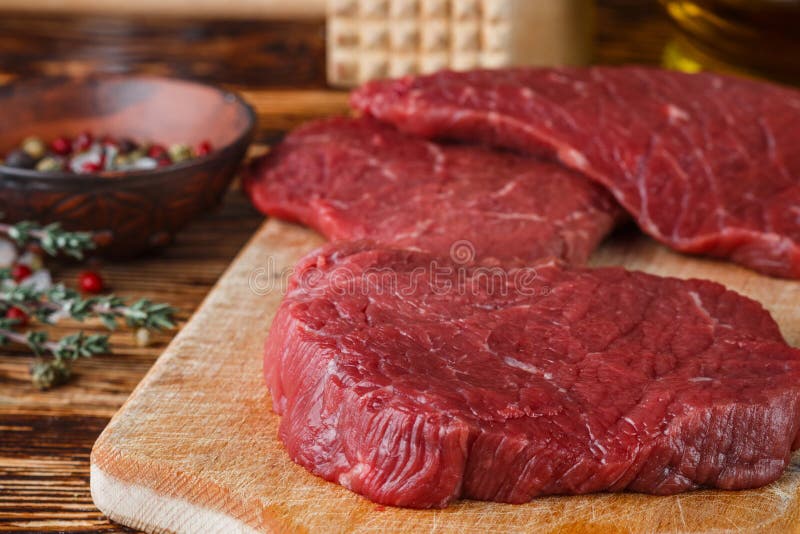 Fresh Meat. Raw Beef Chops on a Cutting Board Stock Photo - Image of ...