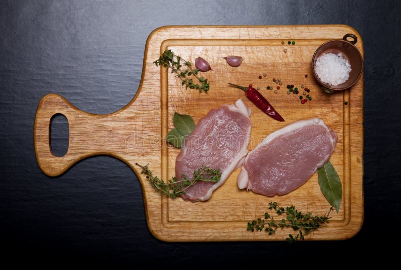 Fresh Meat Steaks on Light Wooden Cutting Board Stock Image - Image of ...