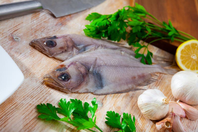 Fresh Megrim Sole Flatfish on Wooden Board Stock Photo - Image of diet ...