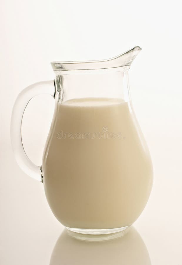 Fresh Milk in Glass Pitcher on Light Background Stock Photo - Image of ...