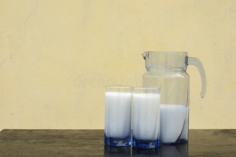 Fresh Milk Poured from Pitcher into Two Glasses, Healthy Cow Milk with ...