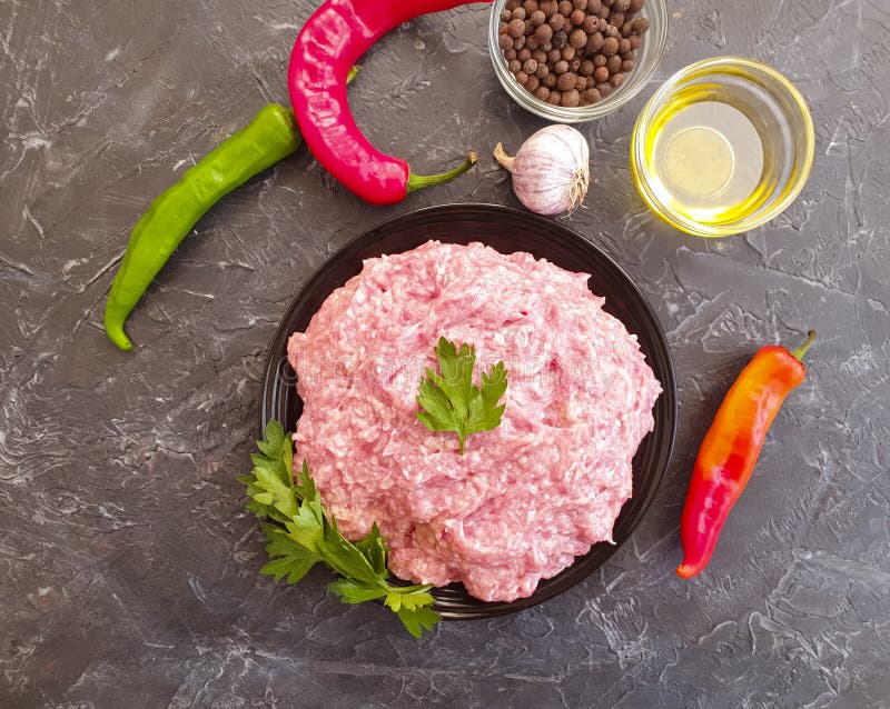 Fresh Minced Meat, Pepper on a Concrete Background Stock Photo - Image ...