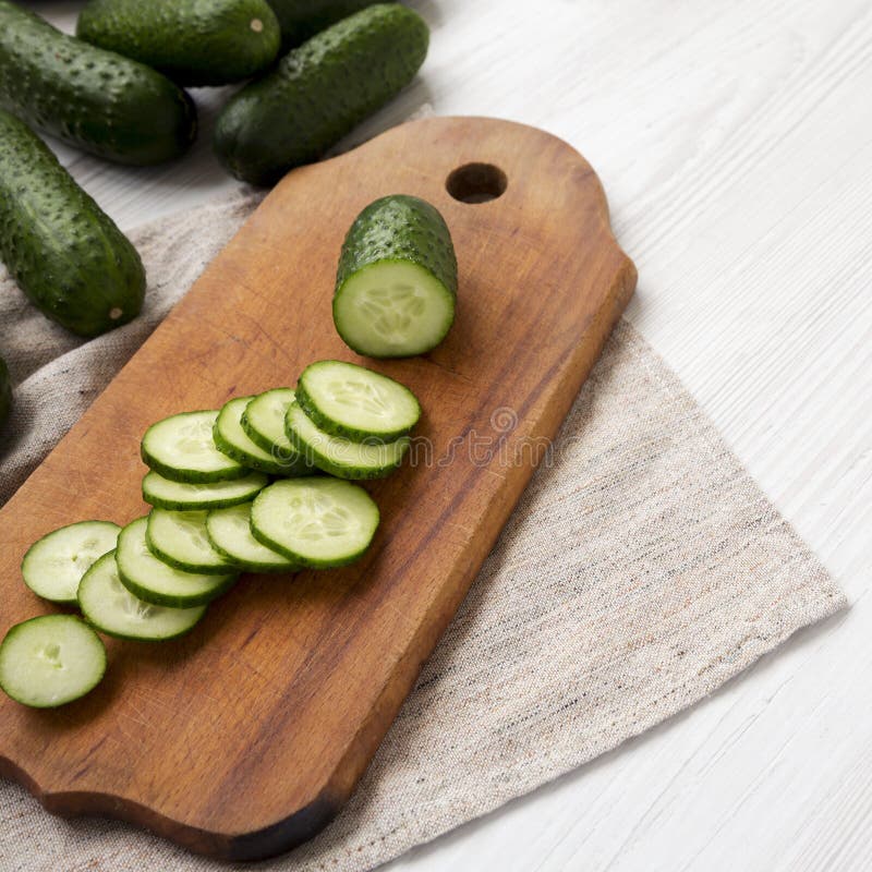 Fresh Mini Baby Cucumbers on a Rustic Wooden Board, Side View. Space ...