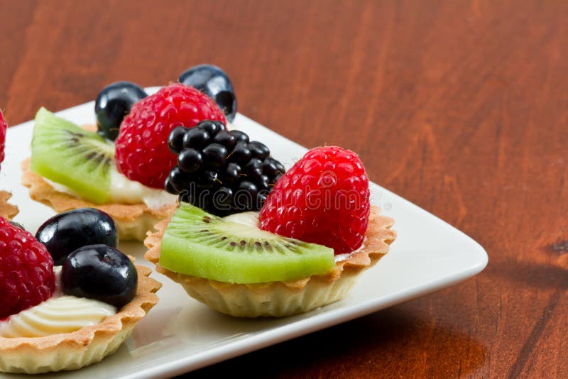Fresh mini fruit tarts stock image. Image of cream, carbohydrates ...