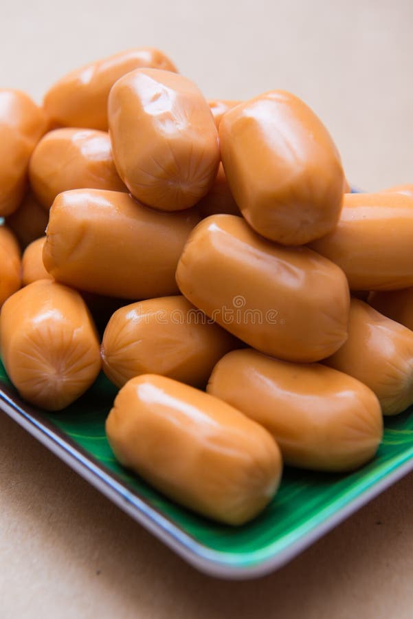 Fresh mini sausage in dish stock photo. Image of pile - 81140224
